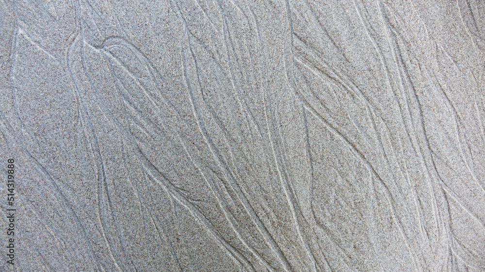 Sand background and texture. Wet beach sand texture after low tide ...