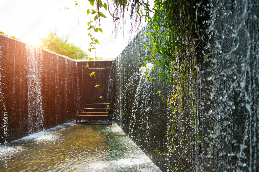 Flowing water like a small waterfall curtain. Water overflowing the ...