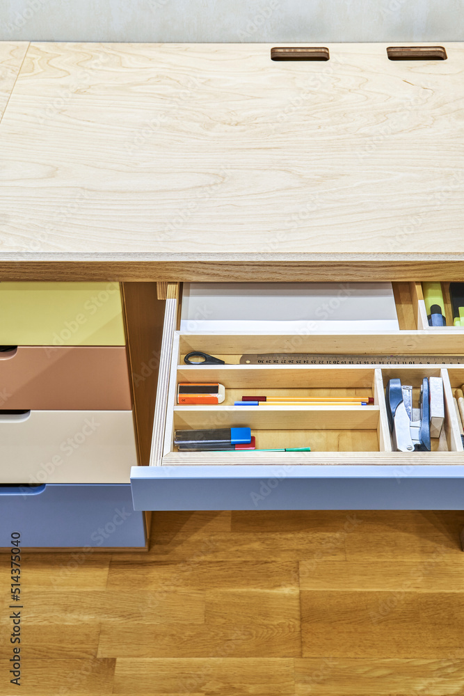 Table for children with multi-colored facades of roll-out drawers for ...