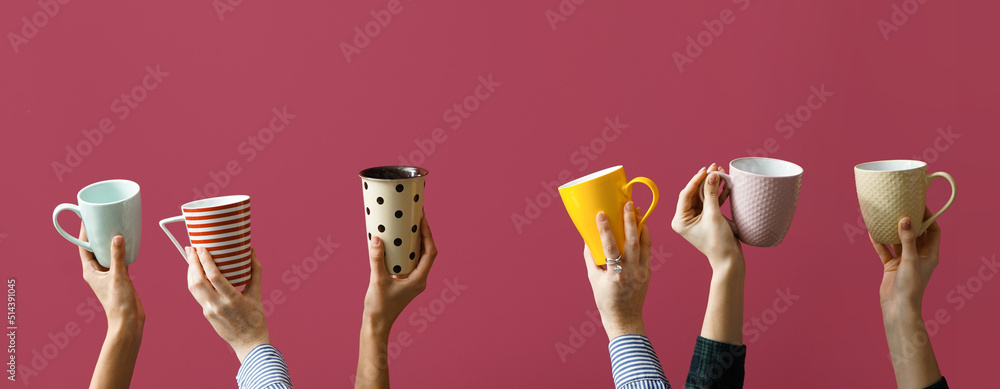 Female hands with many cups on color background Stock Photo | Adobe Stock