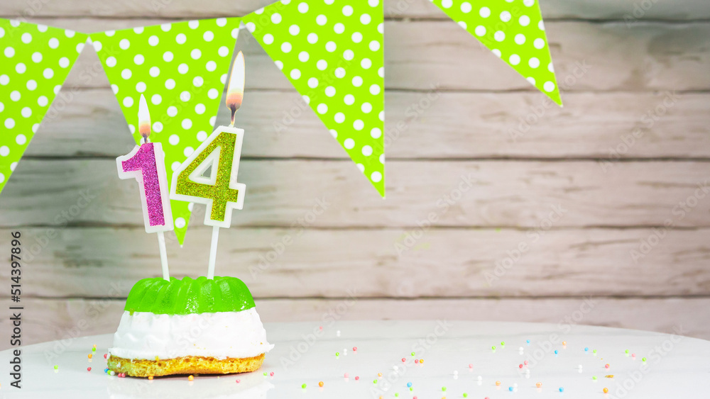 Beautiful festive background with the number 14 with a cake and lit ...