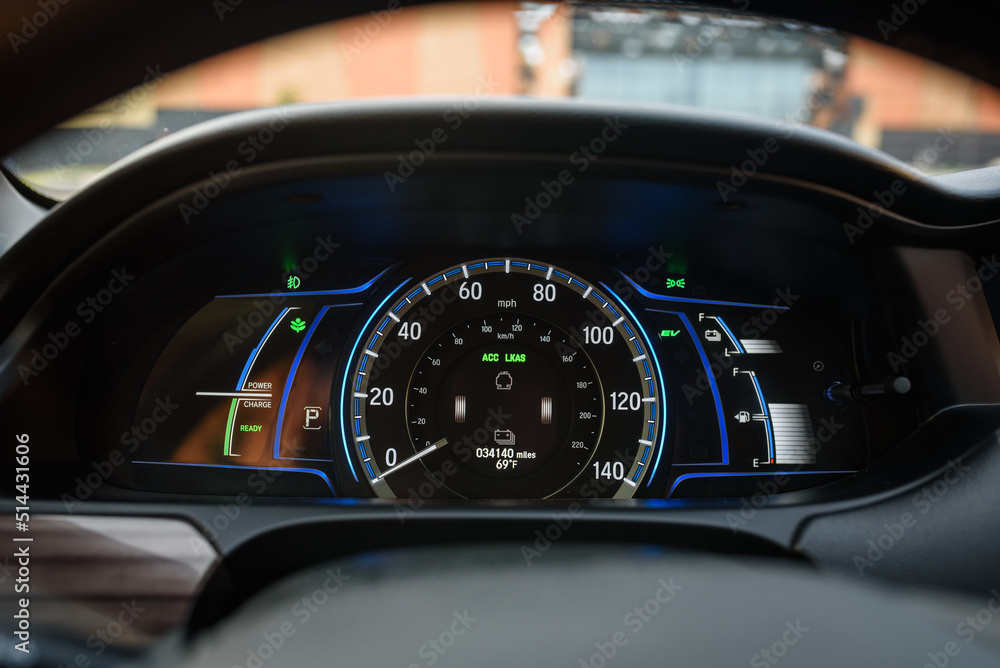 Car counter showing power monitor of engine and battery use in a hybrid ...