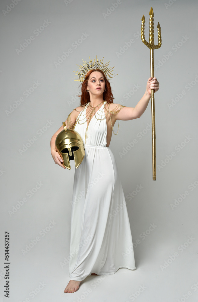 Full length portrait of beautiful red head woman wearing long flowing ...