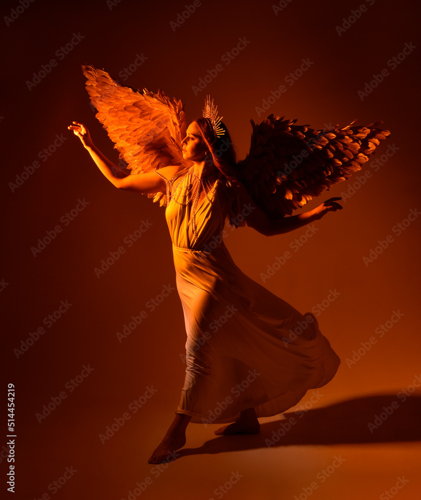 Full length portrait of beautiful red head woman wearing long flowing ...