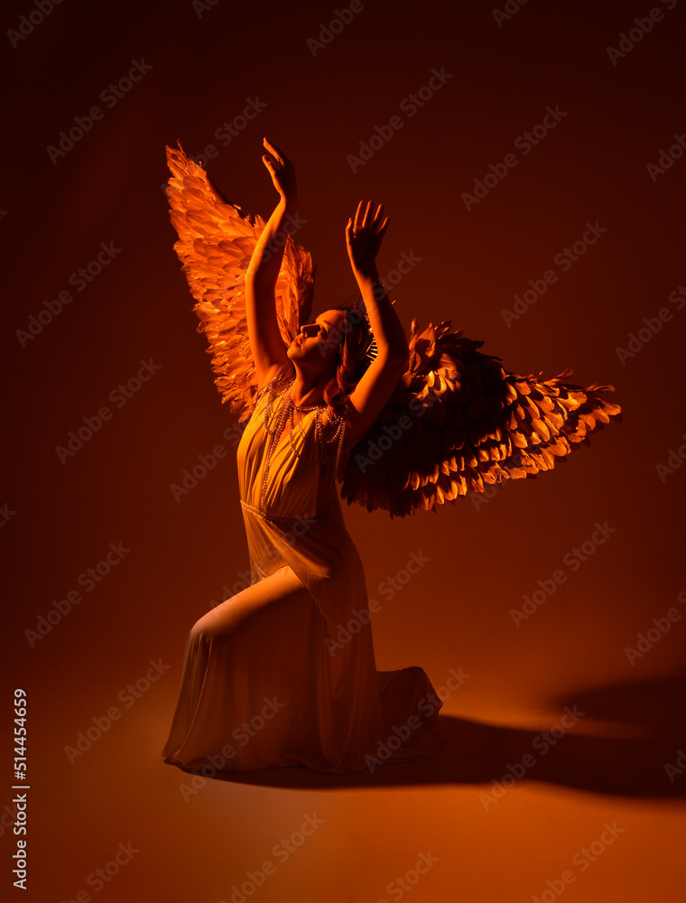 Full length portrait of beautiful red head woman wearing long flowing ...