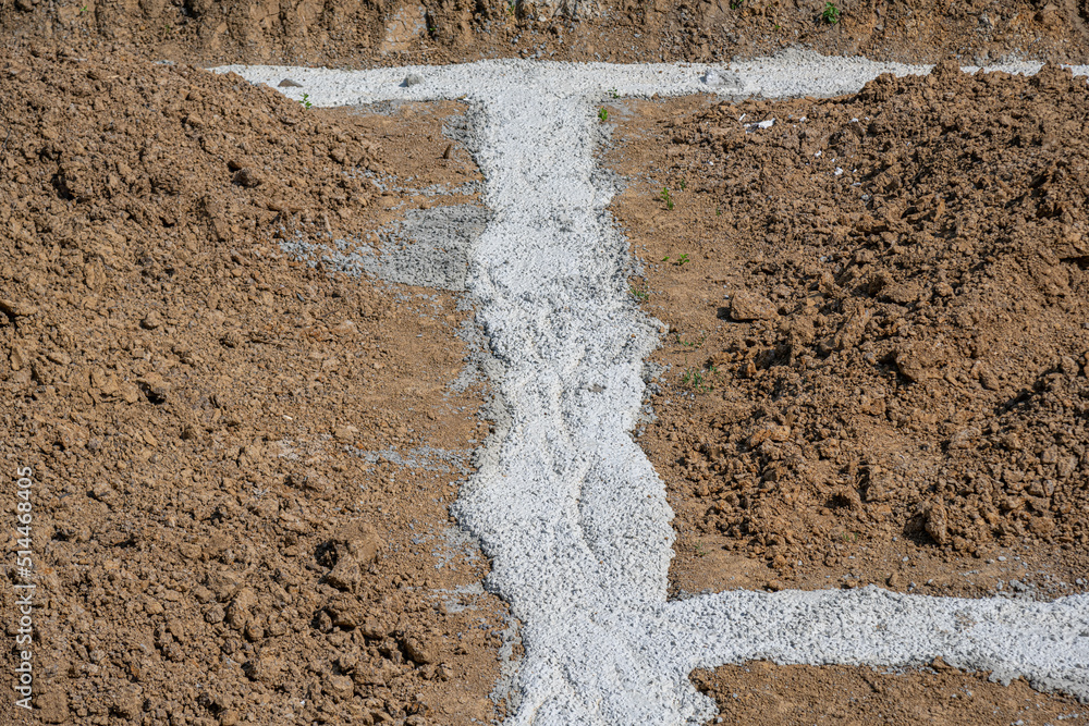 Building a concrete foundation for a house. The rubble foundation of ...