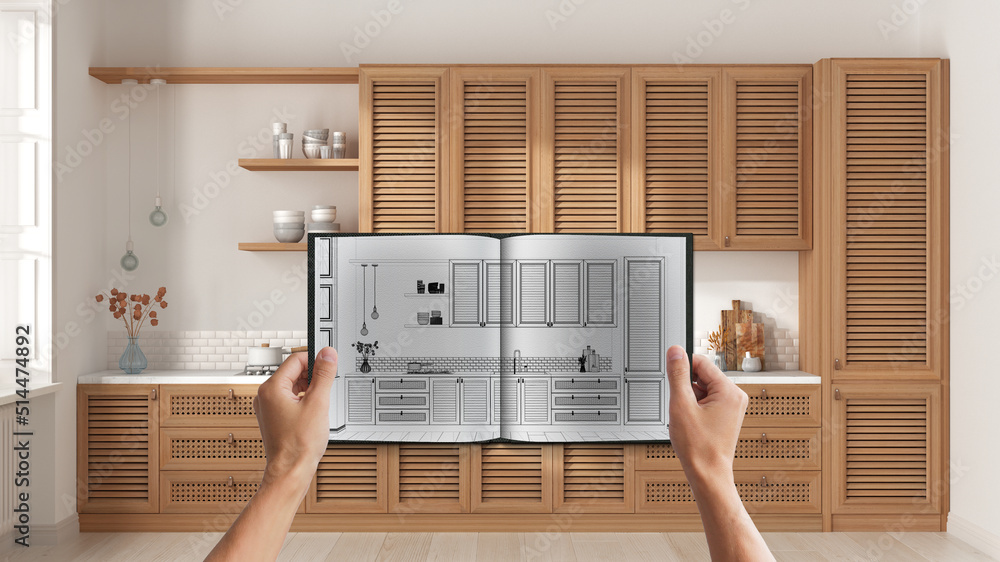 Hands holding notepad with cozy wooden kitchen design blueprint sketch ...