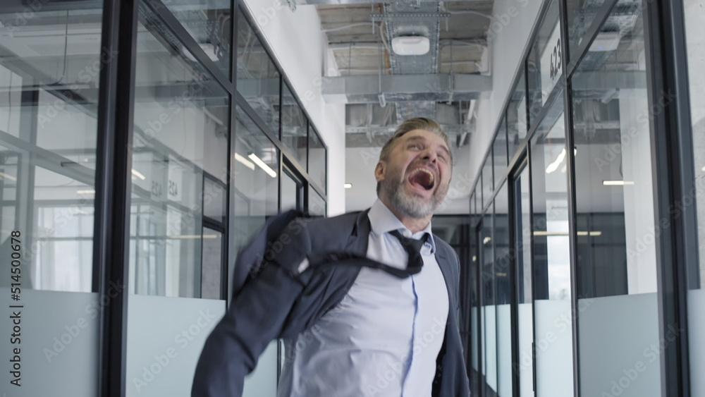 Extremely excited businessman running in hall and screaming, completing ...