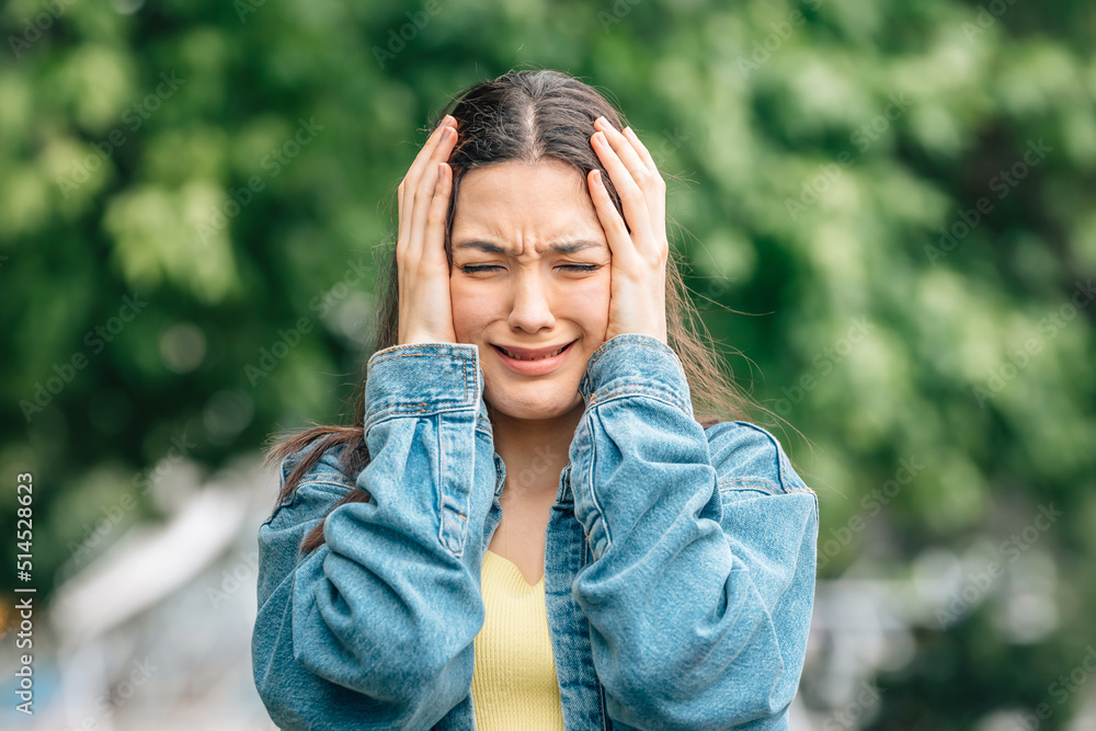 sad girl crying embarrassed outdoors Stock Photo | Adobe Stock