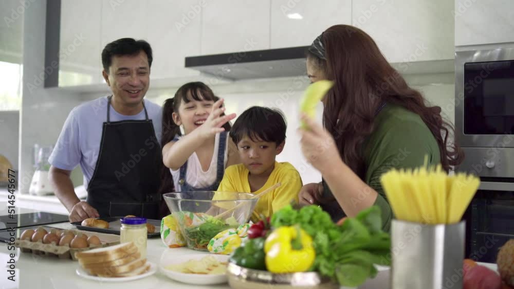 Asian families cook together on weekends. Happy families are helping ...