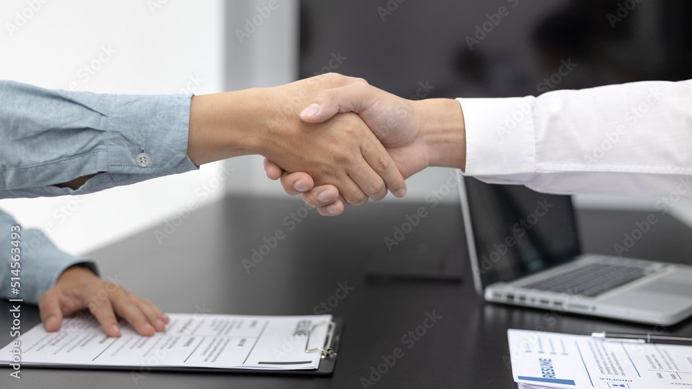 Employer or HR department welcomes new employees, Shaking hands with ...