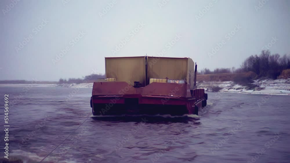 The barge pulls the cargo in the frame. clip. A cargo barge with a ...