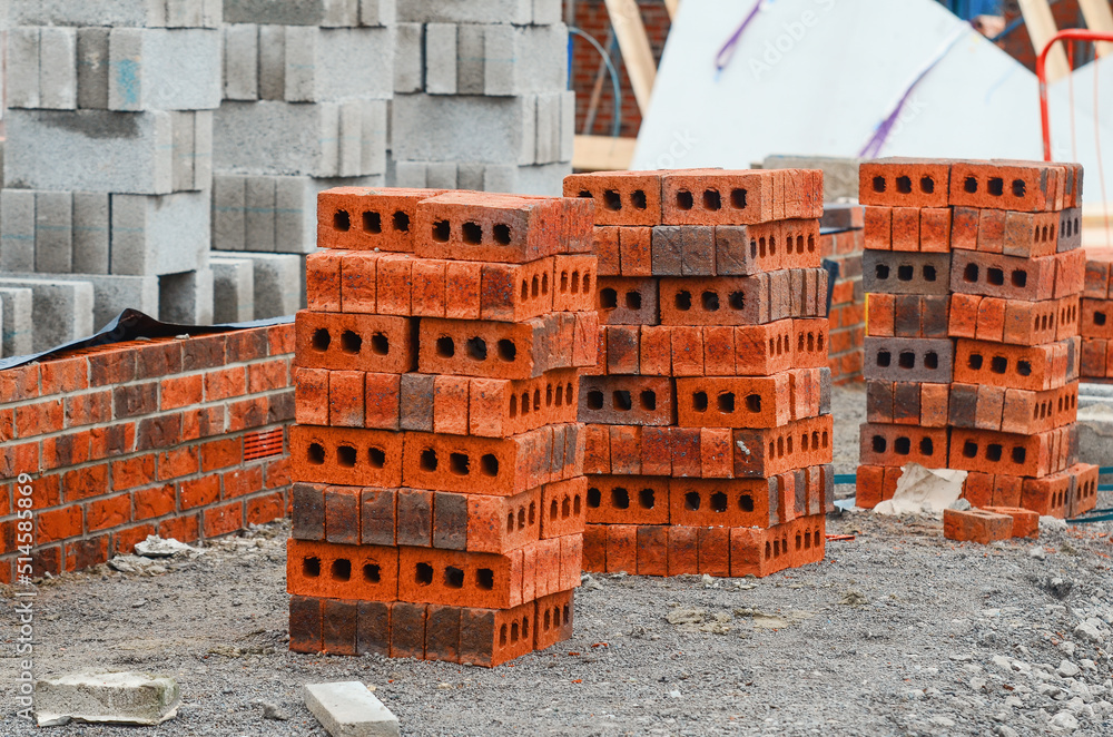 Red bricks and concrete blocks delivered on construction site and ...
