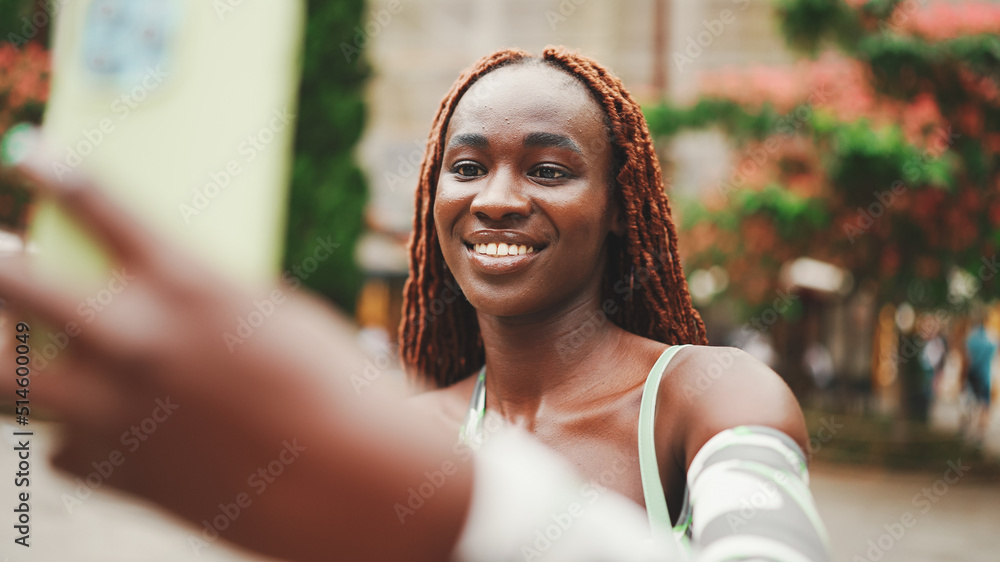 Clouse-up, smiling gorgeous woman with African braids wearing top ...