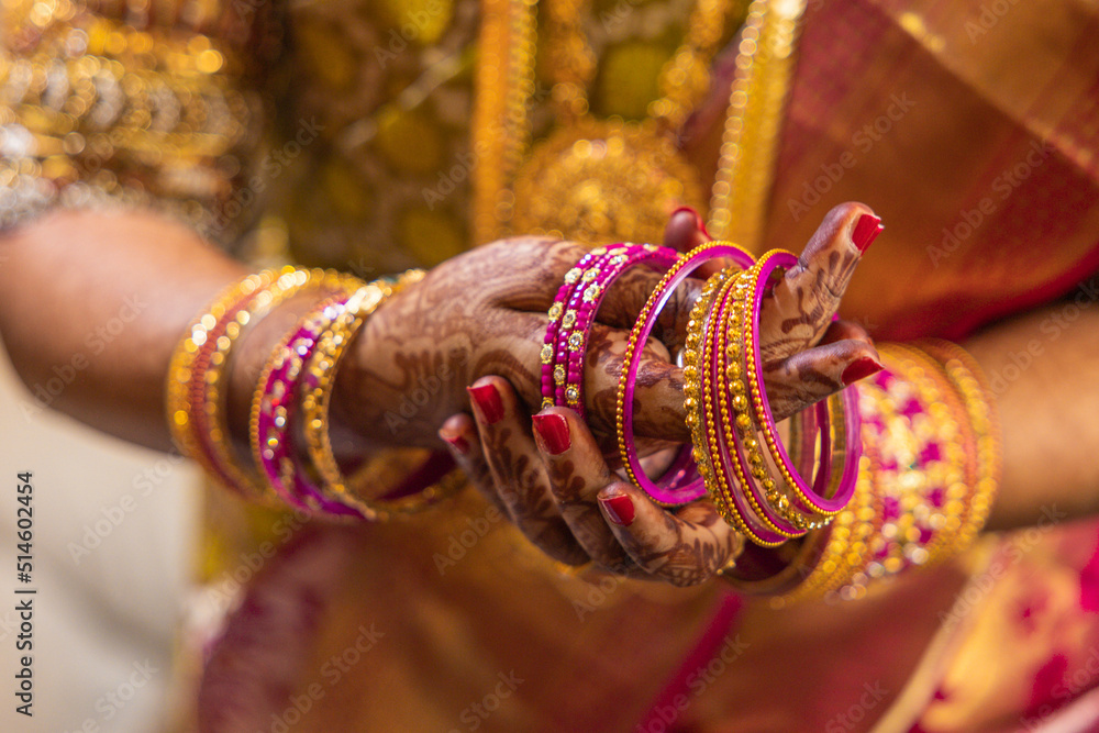 indian bride wearing bangles Stock Photo | Adobe Stock