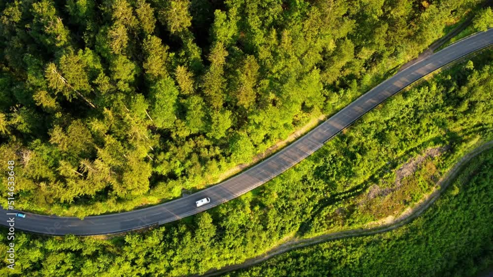 Vidéo Stock Aerial steady footage of white cars driving on curvy ...