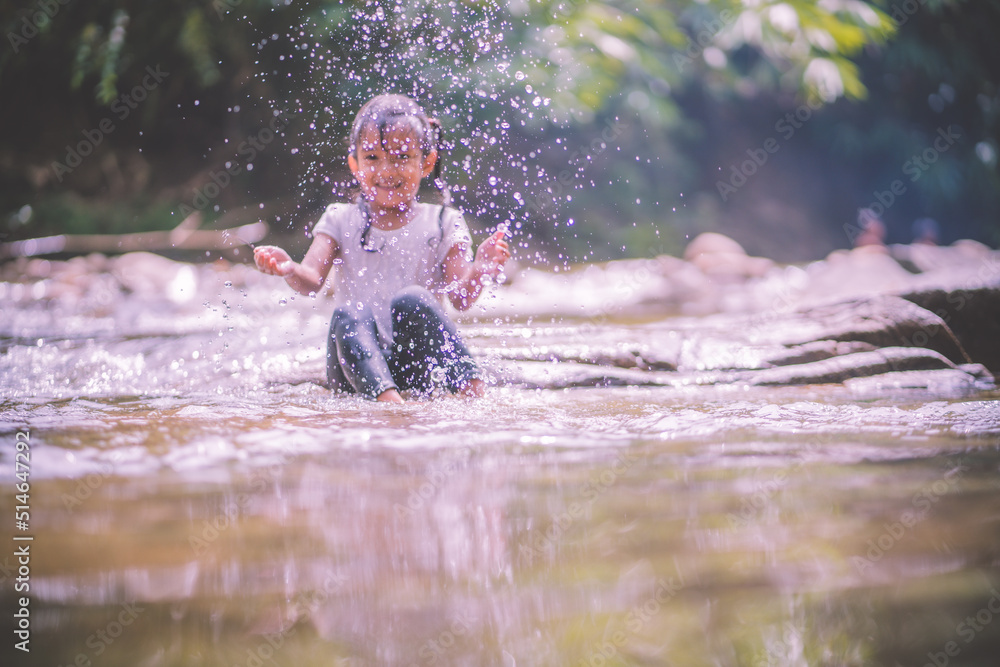 girls having fun playing in the waterfall Stock Photo | Adobe Stock