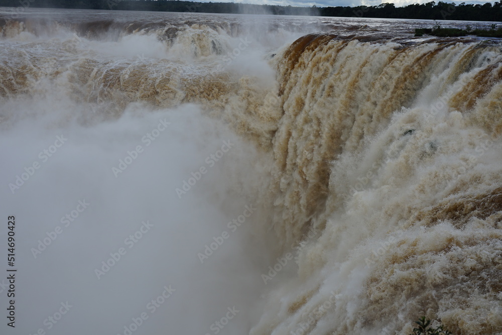The photo shows a stunning view from the top of the Iguazu Falls — a ...