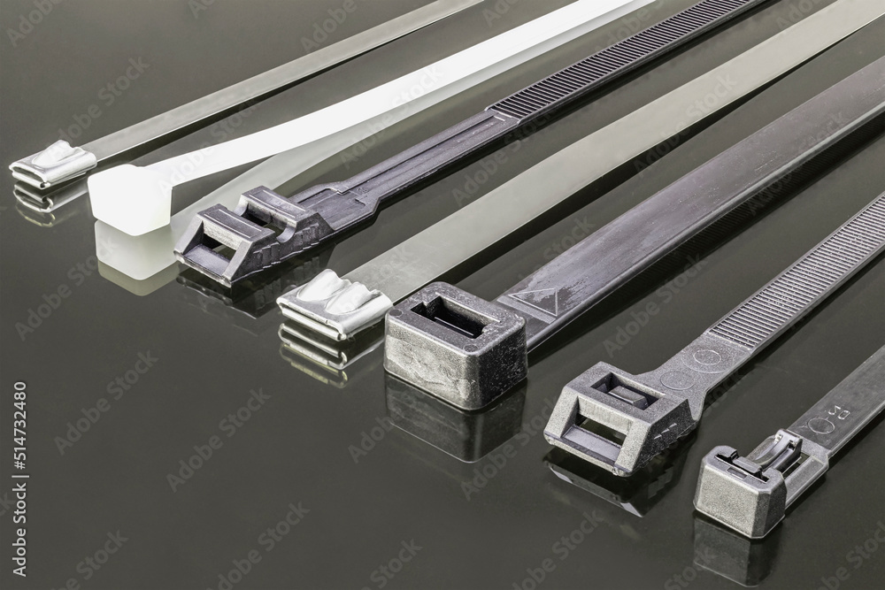 Various types of clamps for fastening electrical wires. Plastic and ...