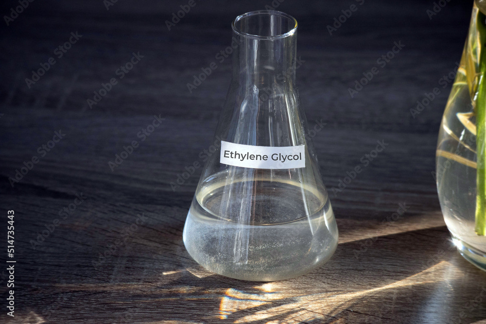 Ethylene Glycol is poured into a glass flask. Ethylene Glycol chemical ...