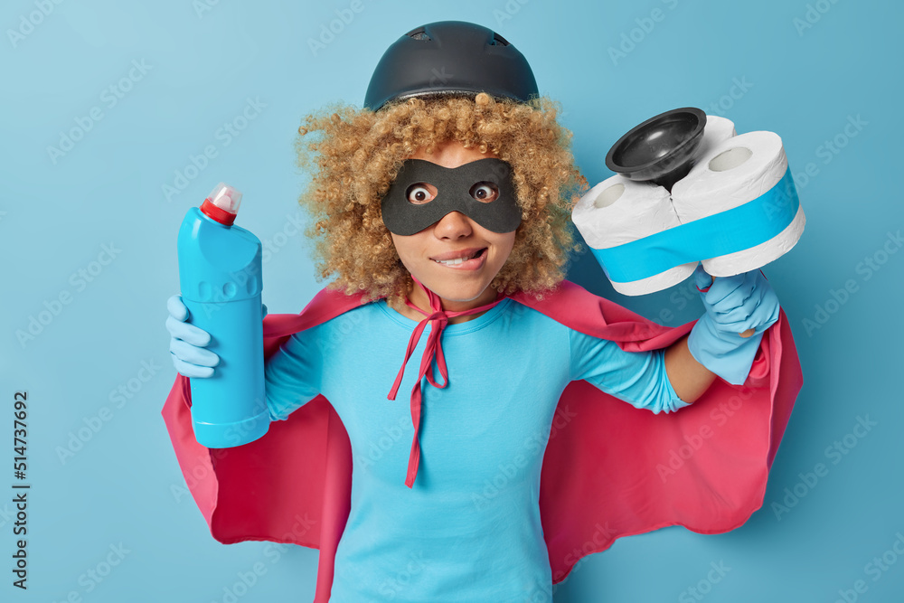 Cleaning service. Surprised curly haired strong woman wears helmet ...