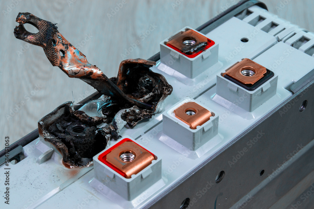 Short-circuited terminals of a lithium battery cell of an electric ...