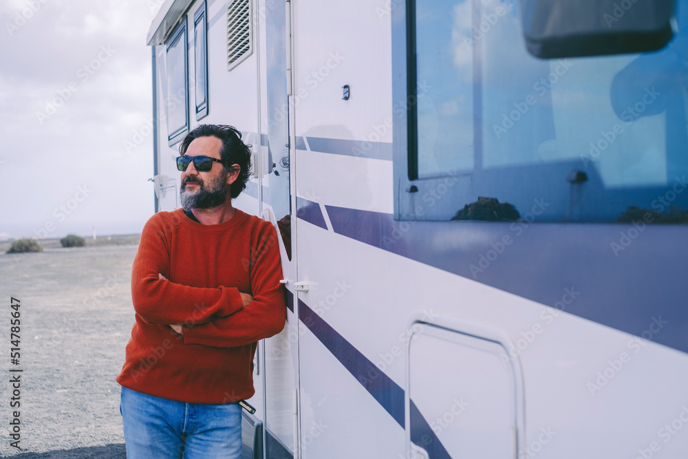 Man standing outside camper van in travel holiday vacation. Renting rv ...