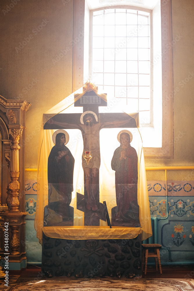 Religion altar with crucifixion of Jesus in the light from a huge ...