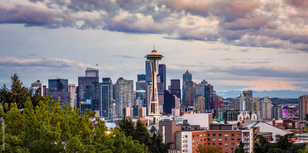 Sunset skyline panorama with the Space Needle and Mount Rainier in ...