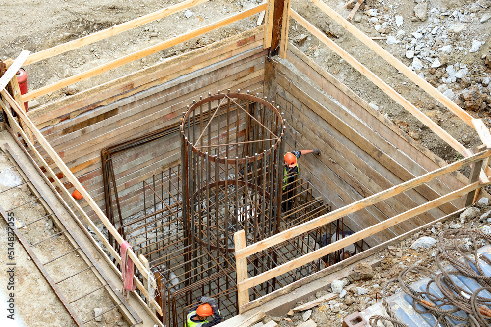Construction site. Workers making a formwork for a concrete column ...