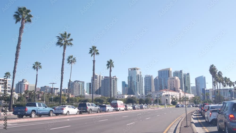 Cars and palm trees on waterfront Harbor drive, highrise skyscrapers in ...