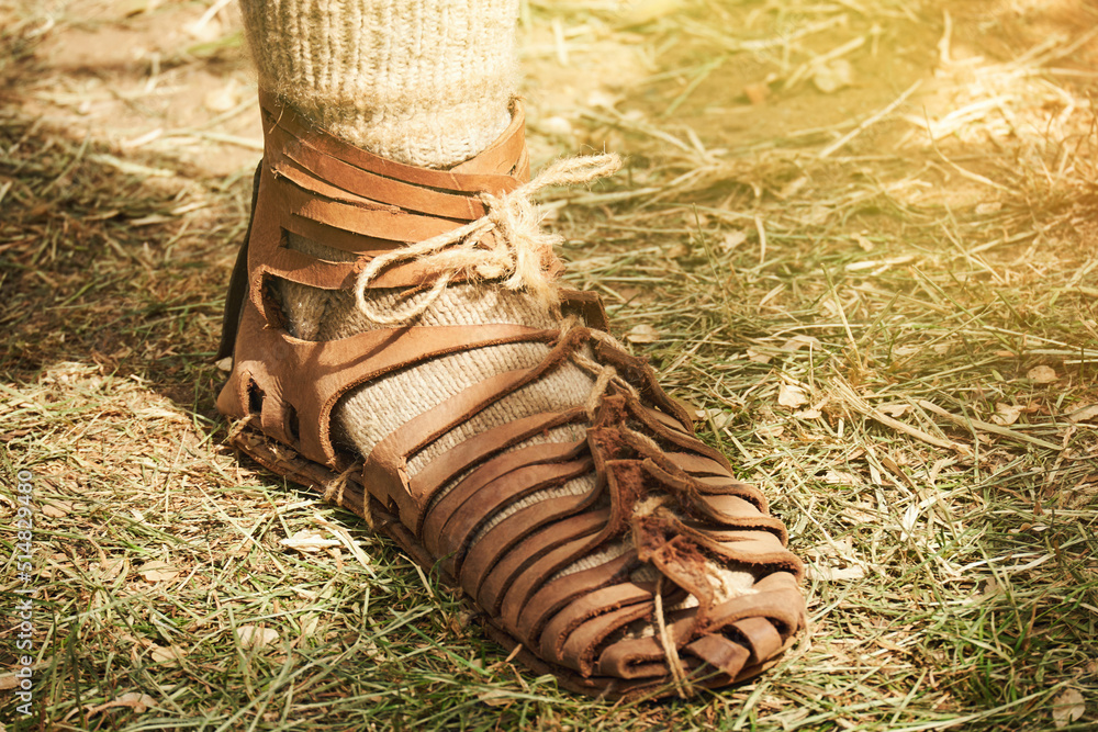 An ancient Roman man legs in caligae leather sandals. Reconstruction of ...