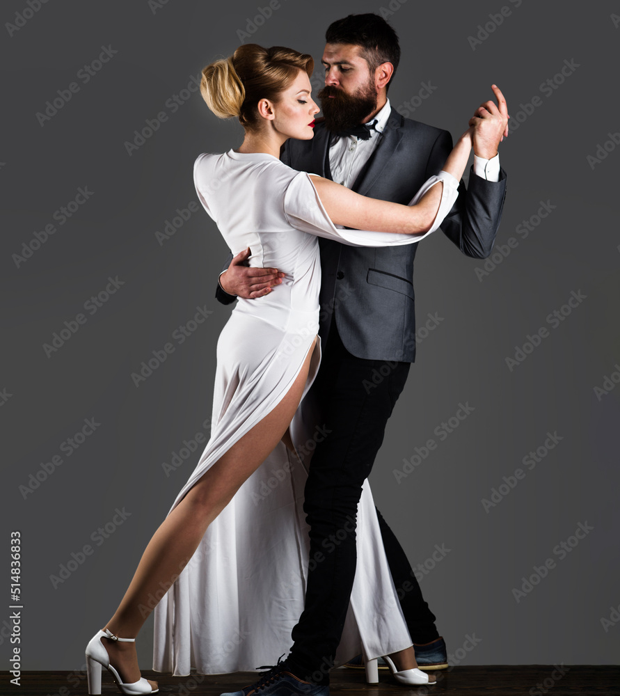 Beautiful couple in love dancing passionate dance. Professional dancers ...