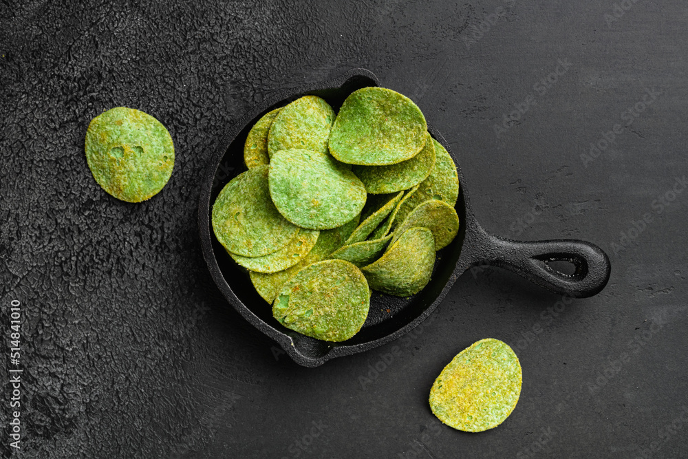 Green Chile Limon Flavored Potato Chips on black dark stone table ...
