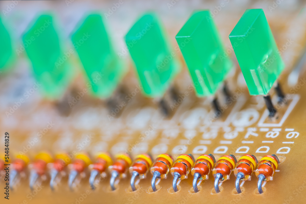 Various semiconductor or LED diodes on blurred printed circuit board ...