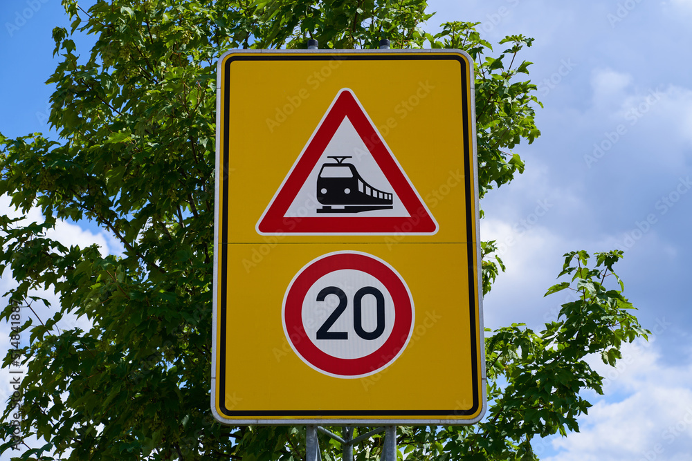 The traffic sign means unrestricted train crossing. The speed limit is ...