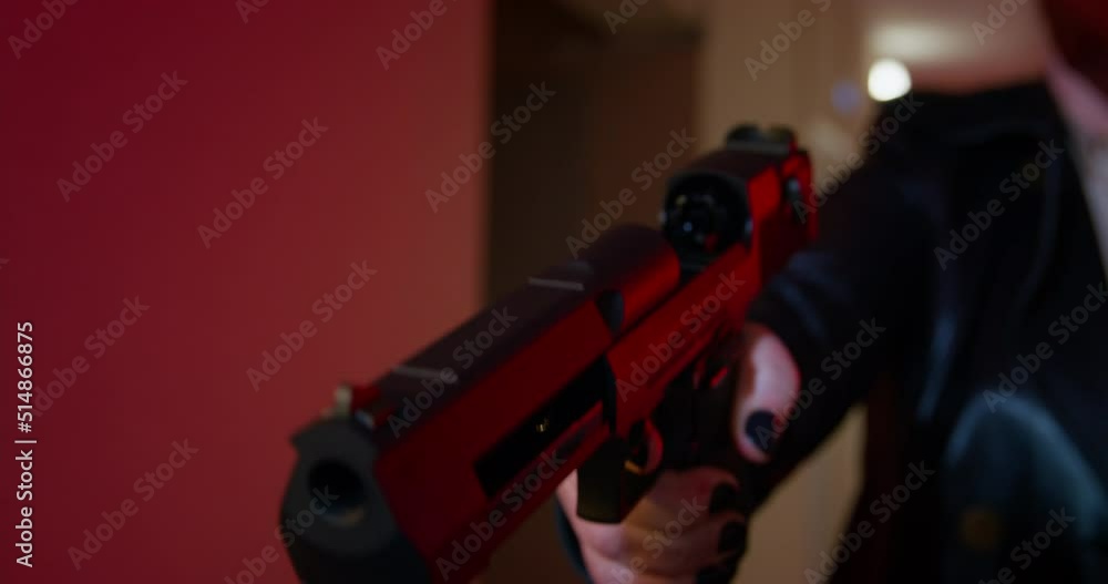 Video „Person in black leather coat is holding gun, aiming at victim or ...