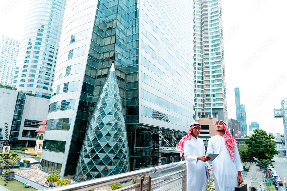 Arab team hold digital tablet uae union teamwork people. Digital ...