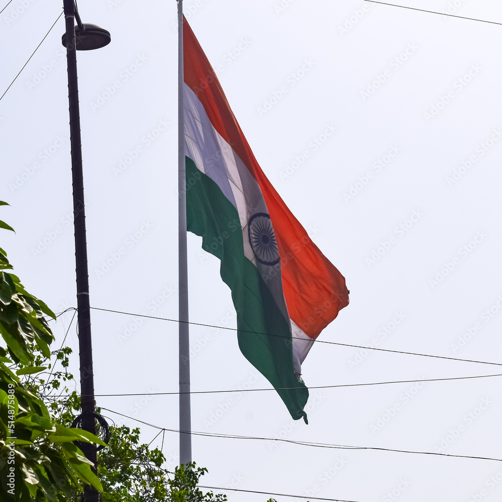 India flag flying high at Connaught Place with pride in blue sky, India ...