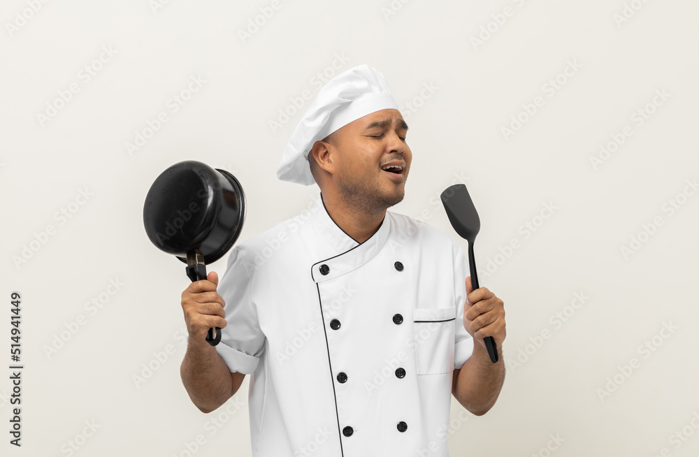 Super star singing masterchef. Young happy asian chef wearing uniform ...