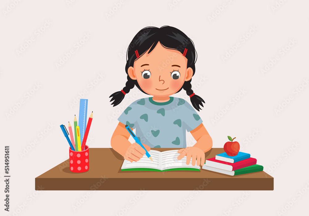 Cute little girl sitting on the desk studying writing on notebook doing ...