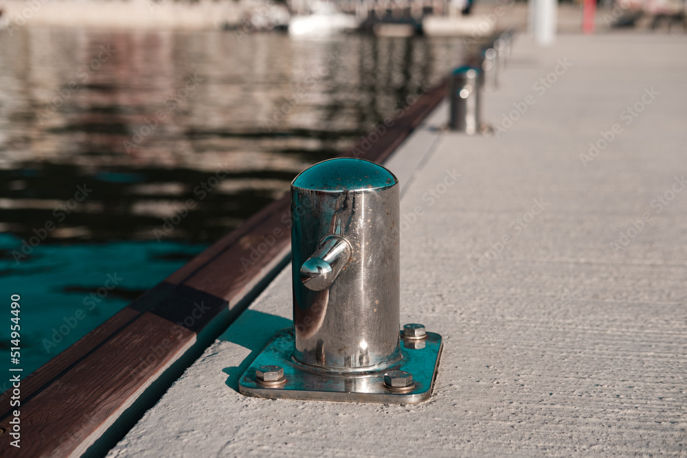marina pier bollard and bollards in line on harbour background Stock ...