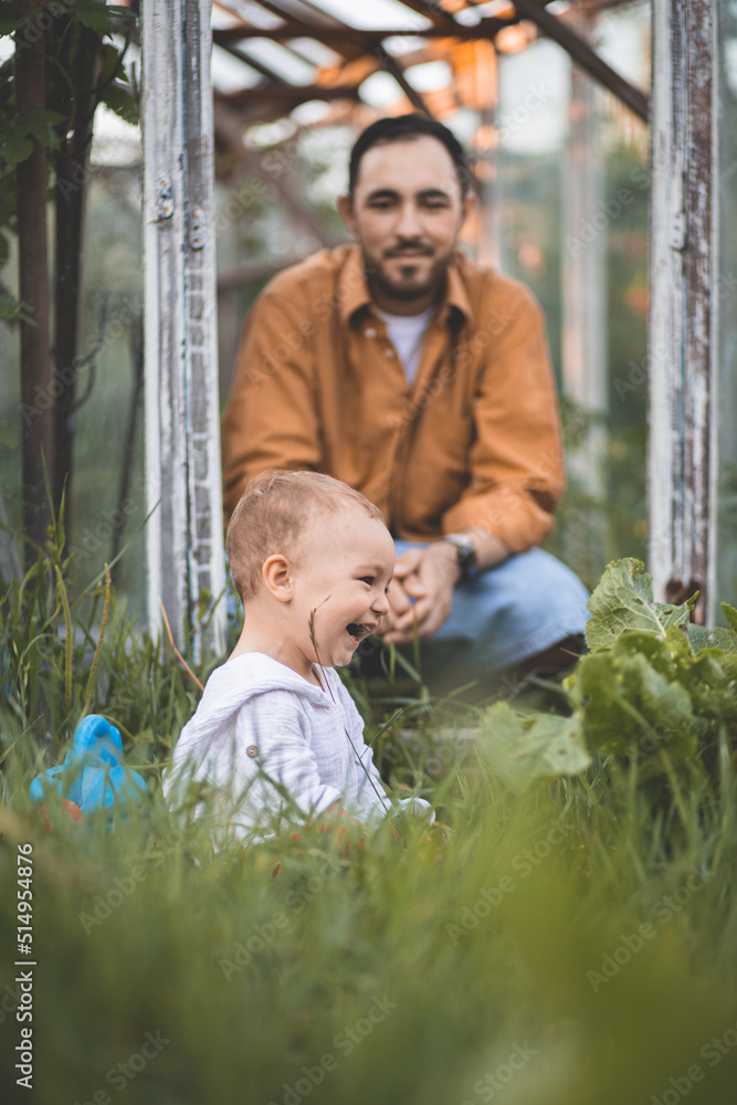 A father spends time with his son. Father and son holding hands. Happy ...