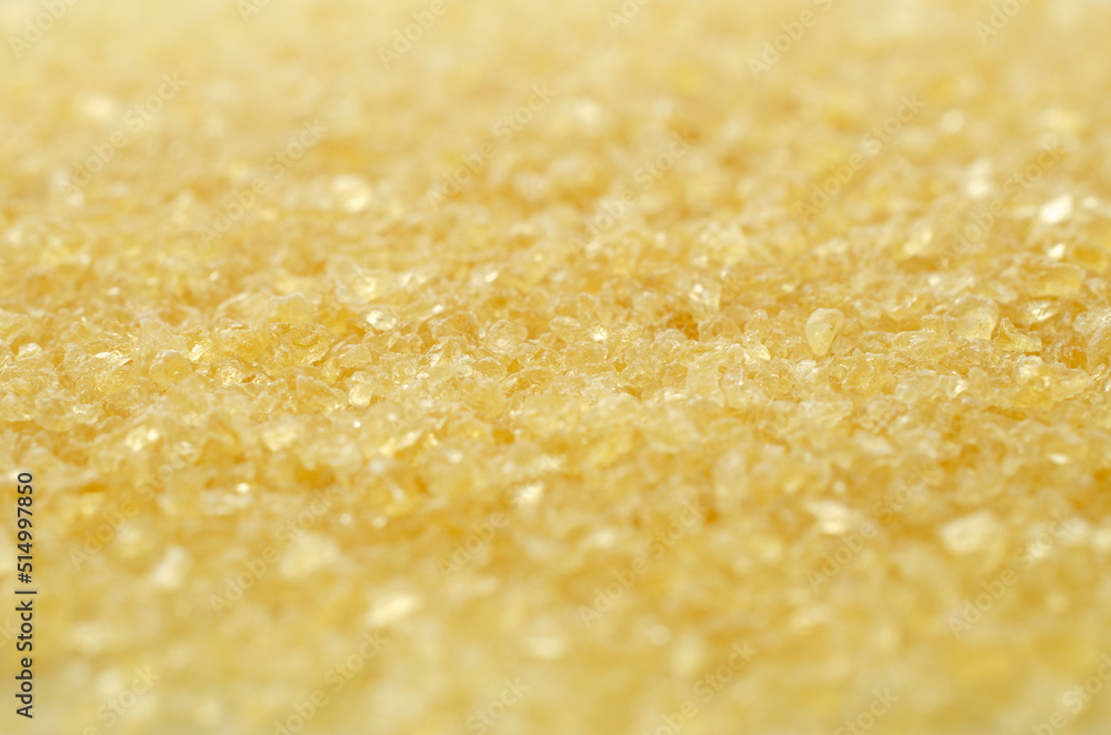 Gelatin, yellow powder top view. Background, texture of crystals of ...