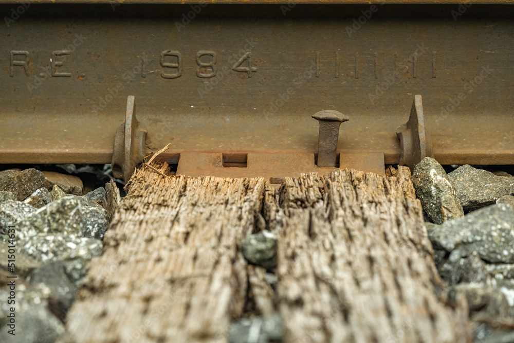 Bolts on a train track used by commuter and freight trains in a ...