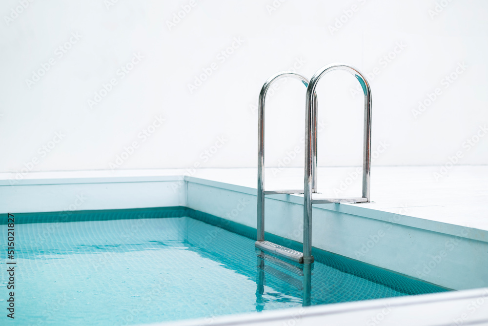 Ladder stainless handrails for descent into swimming pool. Swimming ...