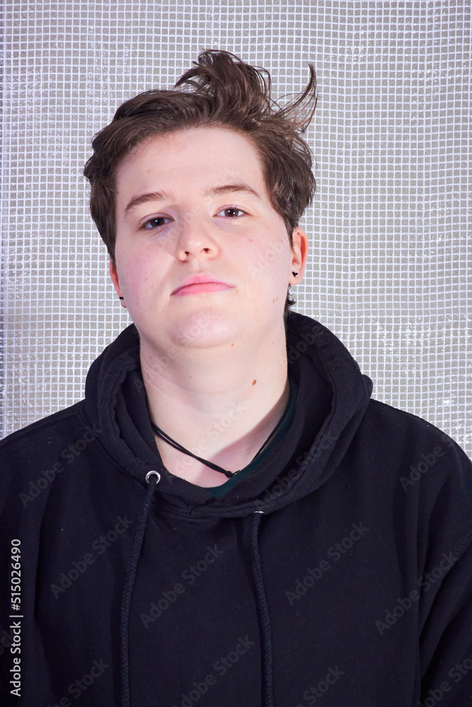 Natural portrait of young handsome transgender man posing with neutral ...