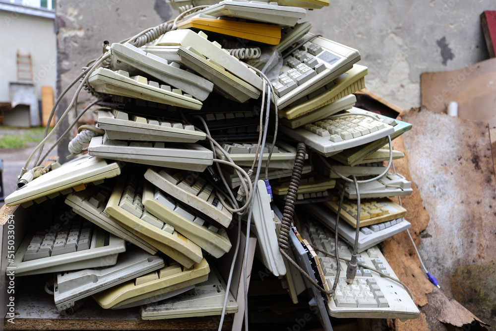 Old office equipment. E-waste devices consist of monitor, printer ...