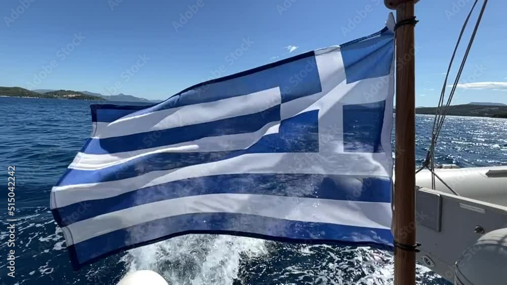 Video Stock Greek flag waving from behind of a catamaran sailing in the ...