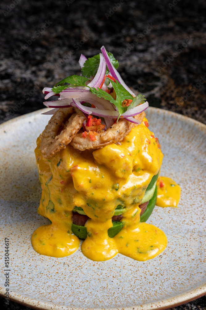 Causa peruana Acevichada, Una causa con ceviche encima Stock Photo ...